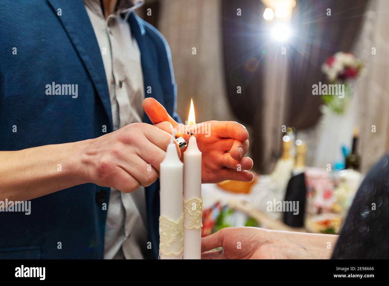 a girl holds a lighted candle in her hands, a religious tradition, a ...