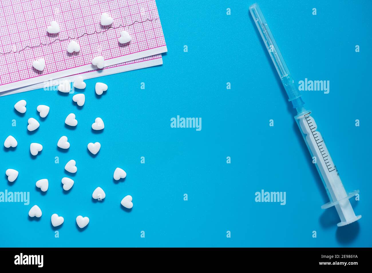 medical topic. Cardiology. electrocardiogram, heart-shaped tablets ...