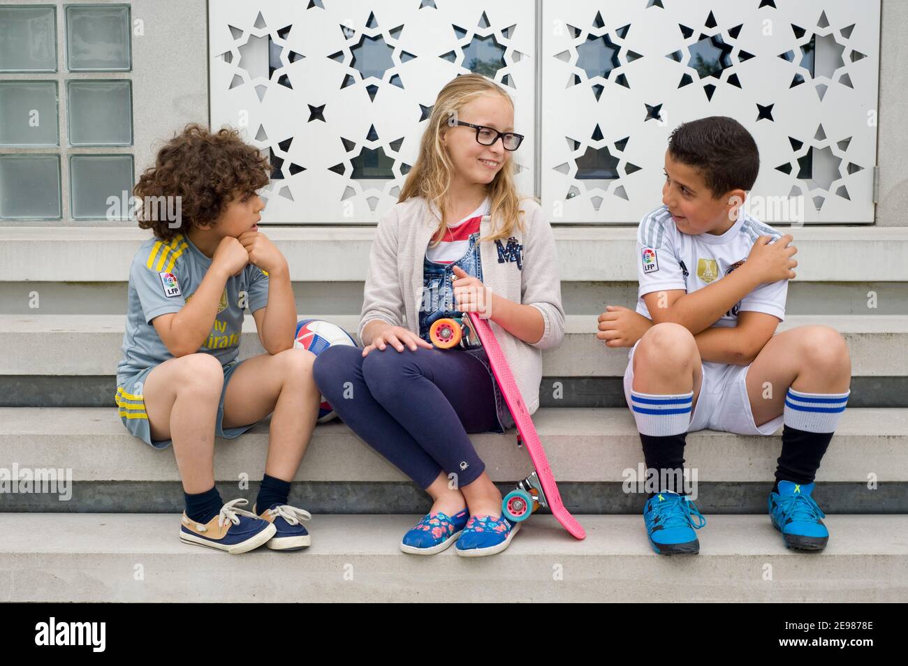 Mosque, children play, football, street photography Stock Photo - Alamy