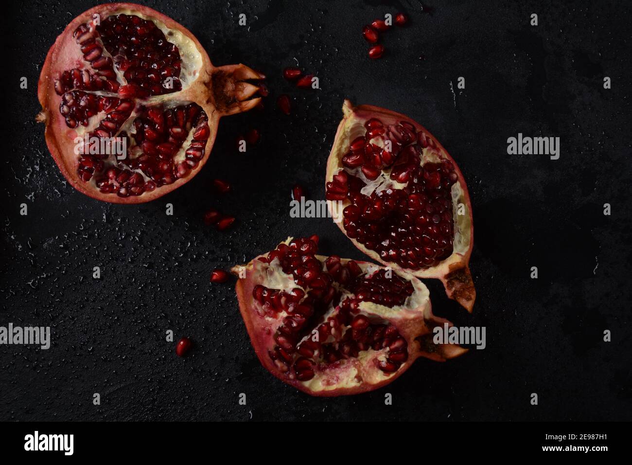 Fresh sliced pomegranates. Half pomegranate and pomegranate grains ...