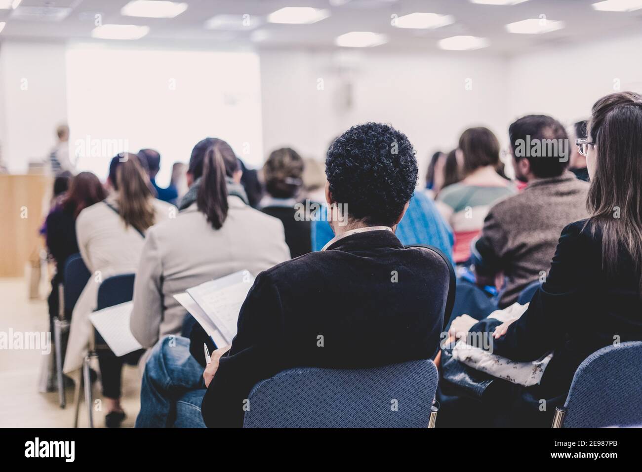 Woman giving presentation on business conference Stock Photo - Alamy