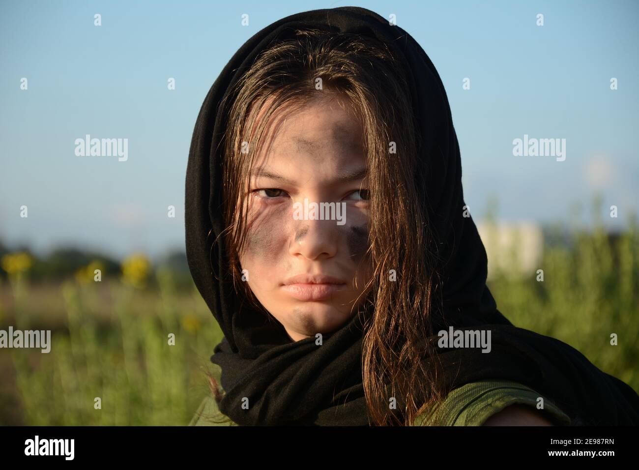 A portrait of a teenage girl militia soldier in a post apocalyptic ...