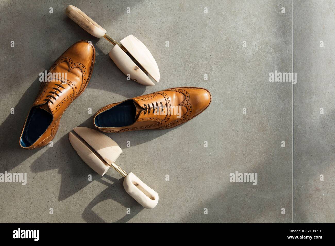 Overhead view of a pair of tan brown leather mens formal shoes on ...