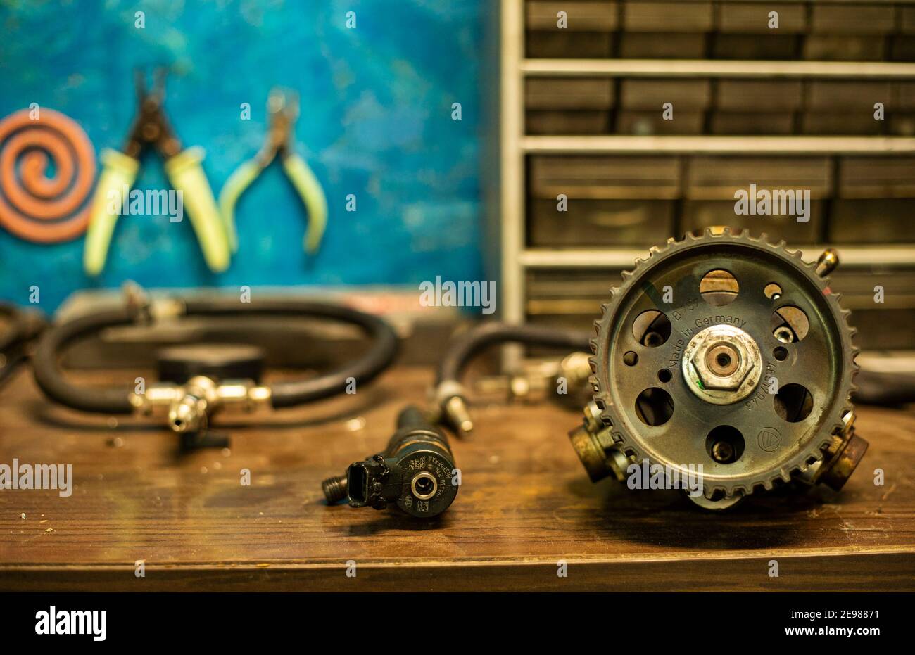 Spare car engine resting on the mechanical workshop bench Stock Photo ...