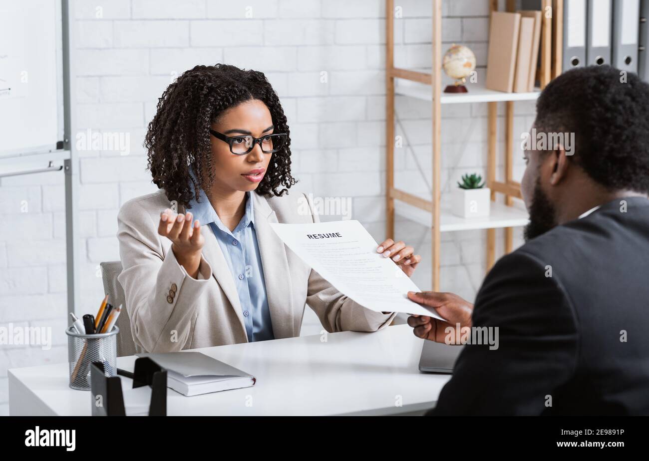 Interview serious hi-res stock photography and images - Alamy