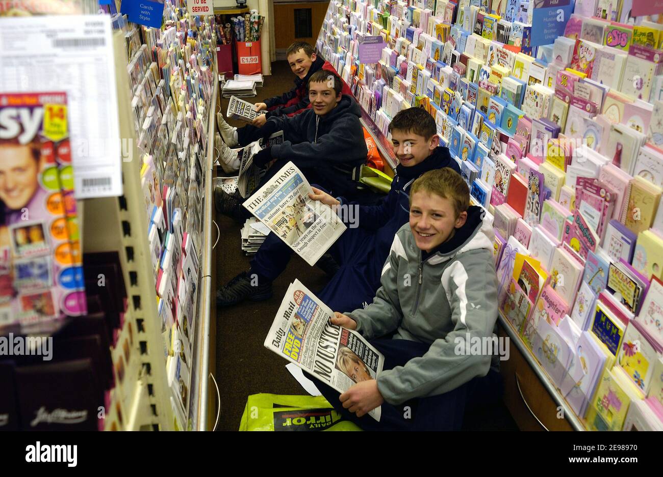 Going to Press Newspaper delivery boys arranging copies of national ...