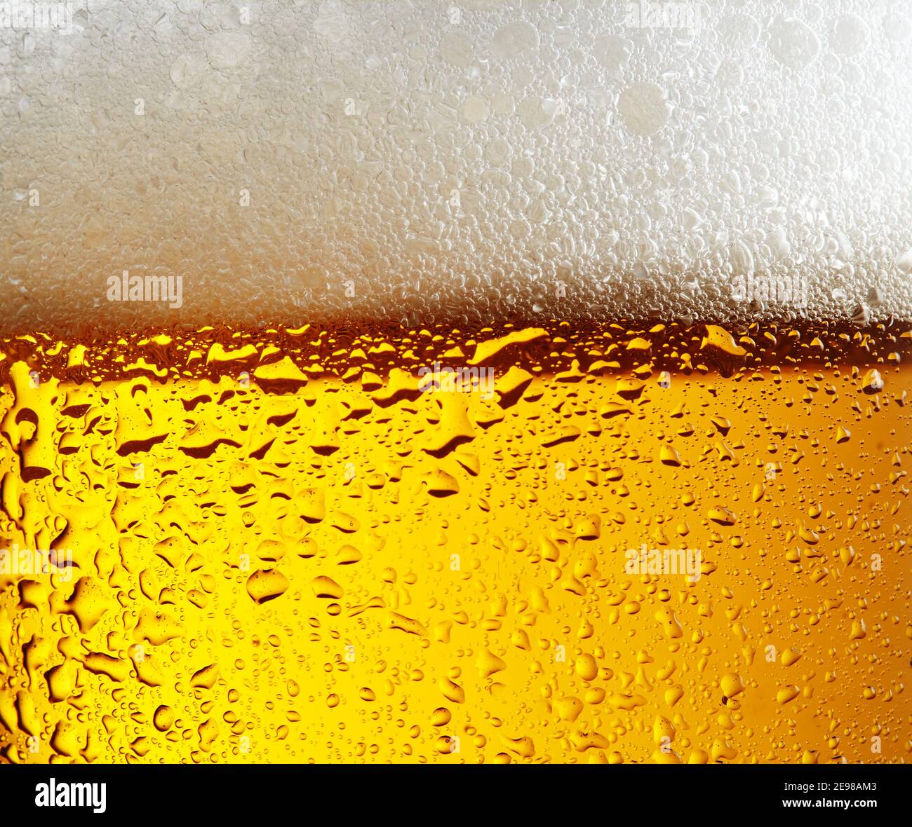 Beer background with bubble froth texture foam pouring alcohol soda in ...