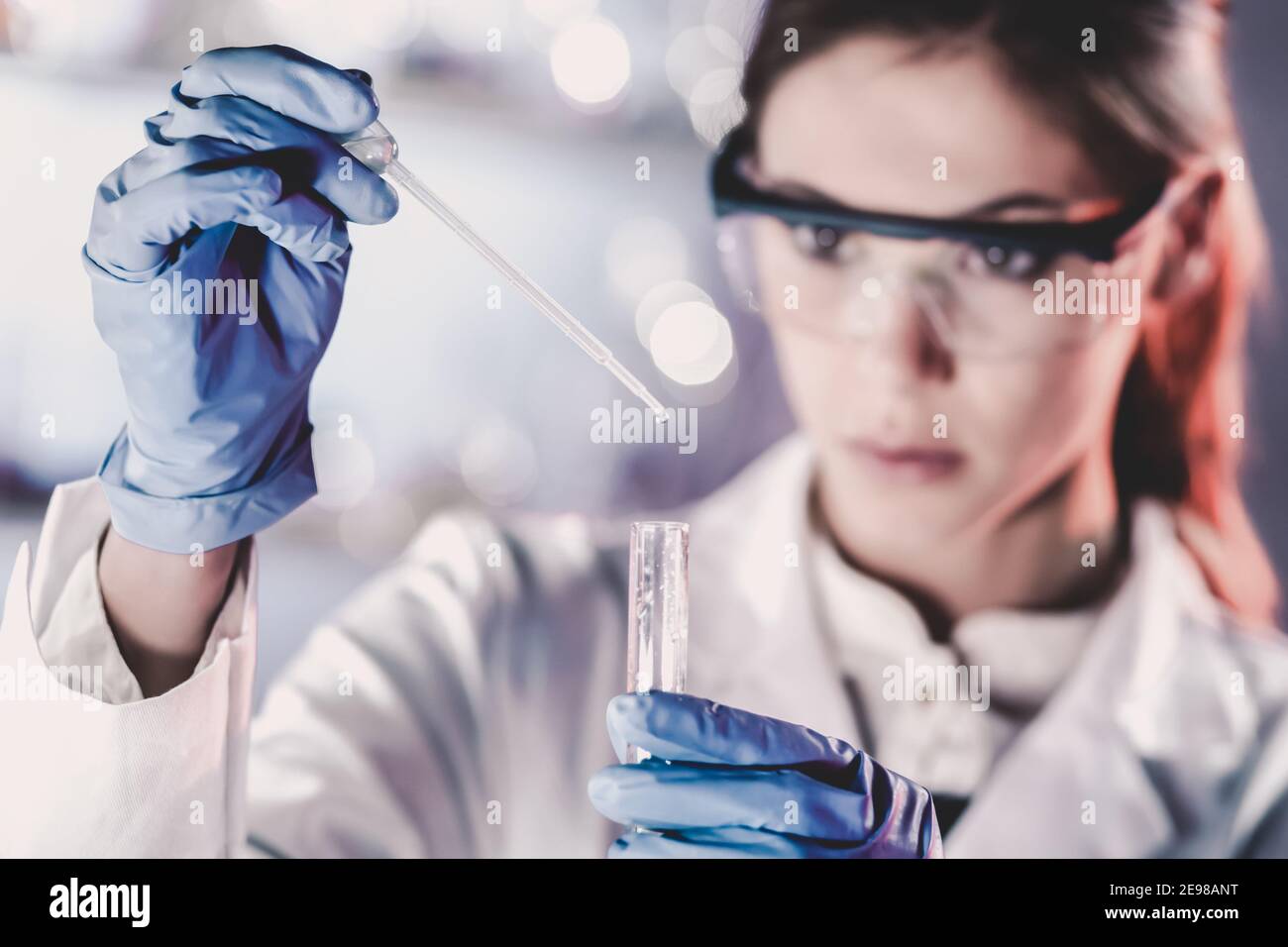 Young scientist pipetting in life science laboratory Stock Photo - Alamy