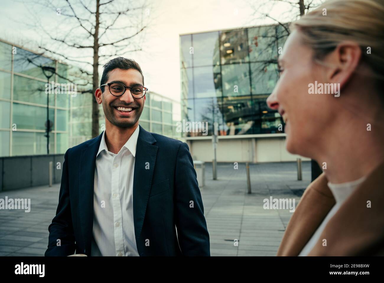 Two men chatting and smiling hi-res stock photography and images - Alamy