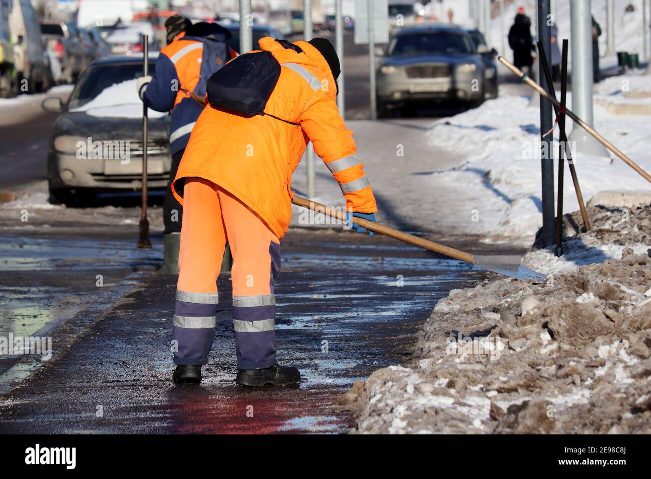 Workers shovel snow in city hi-res stock photography and images - Alamy
