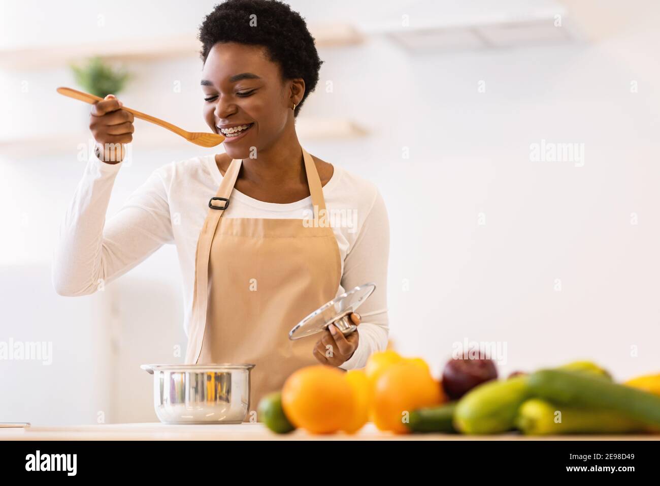Lady cooking in kitchen hi-res stock photography and images - Alamy