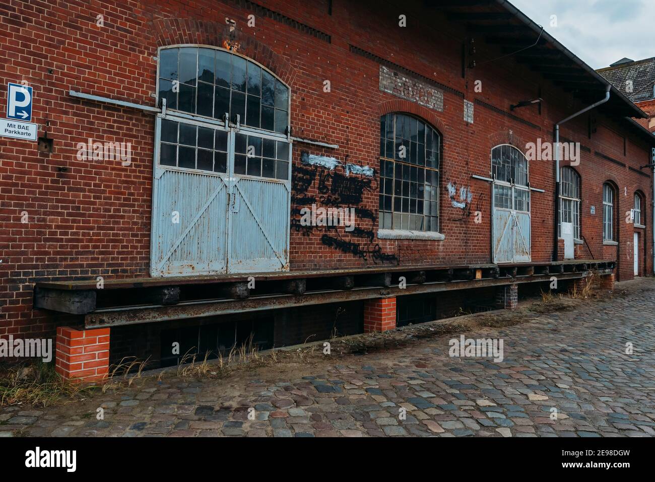 The loading ramp of an old warehouse, loading ramp and a sliding gate ...
