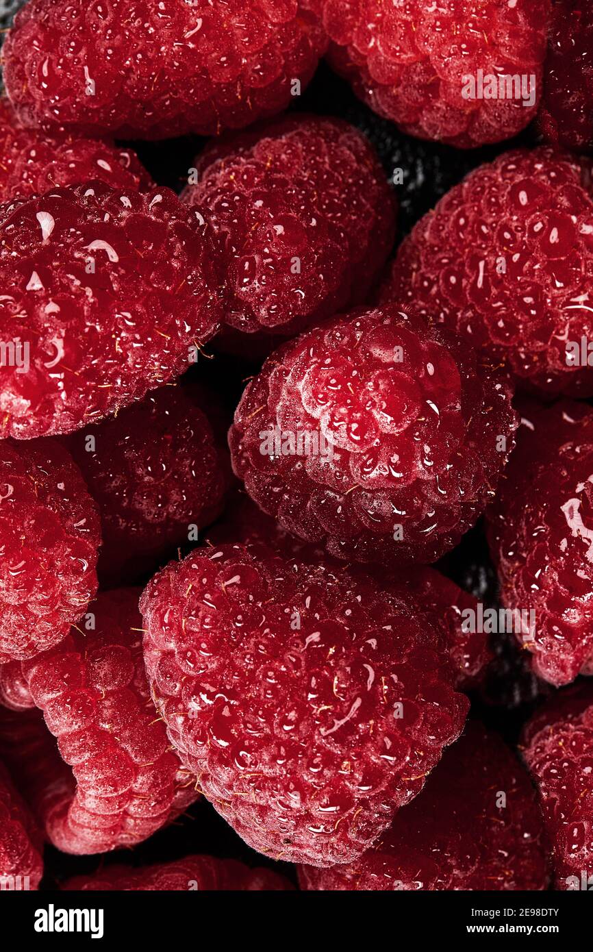 Background of ripe red raspberries, close up Stock Photo - Alamy