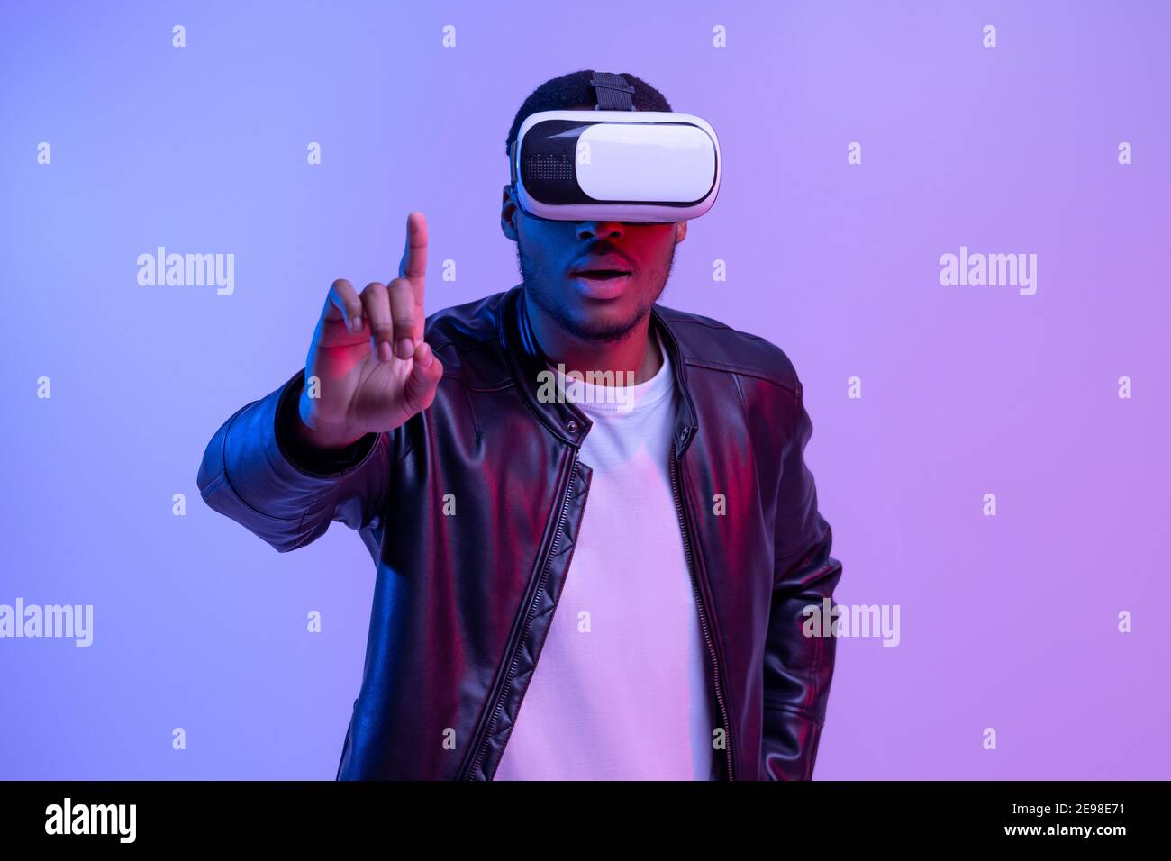 Excited Black Guy In VR Glasses And Jacket Enjoying Virtual Reality ...