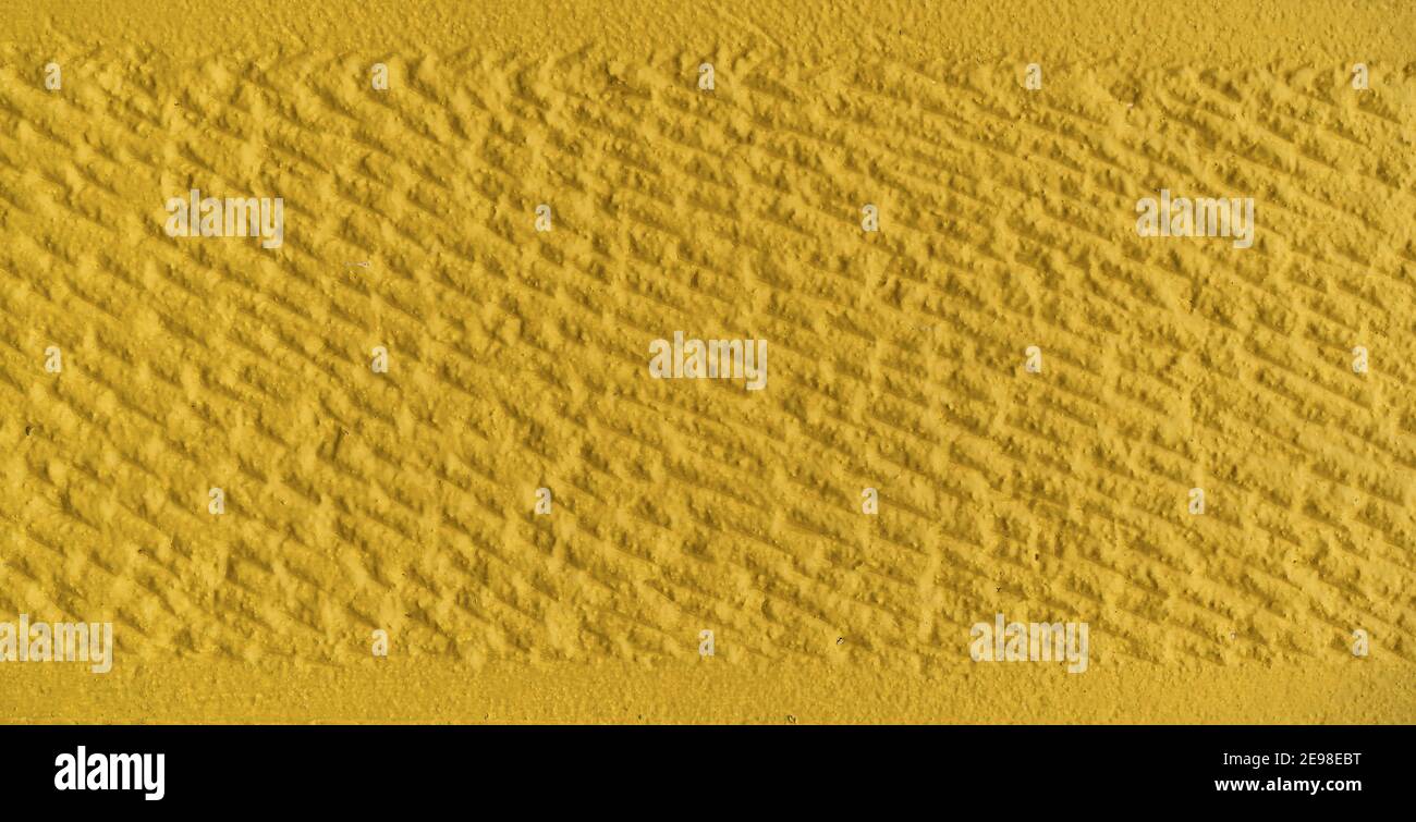 Nice concrete background toned yellow, natural textured surface ...