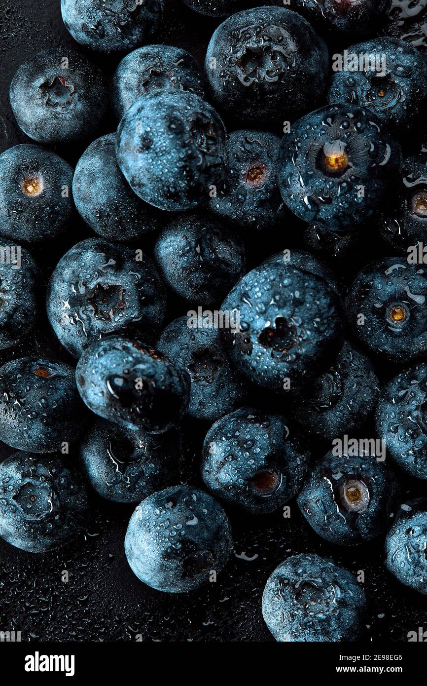 Fresh natural antioxidant blueberries pile, macro detailed close up ...
