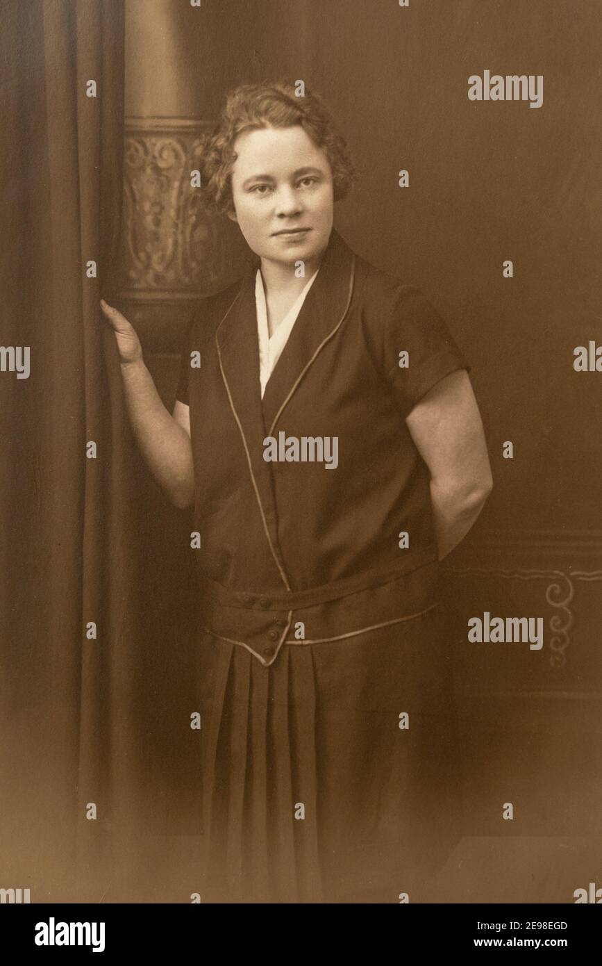 Germany - CIRCA 1930s: Portrait of young woman standing in studio ...