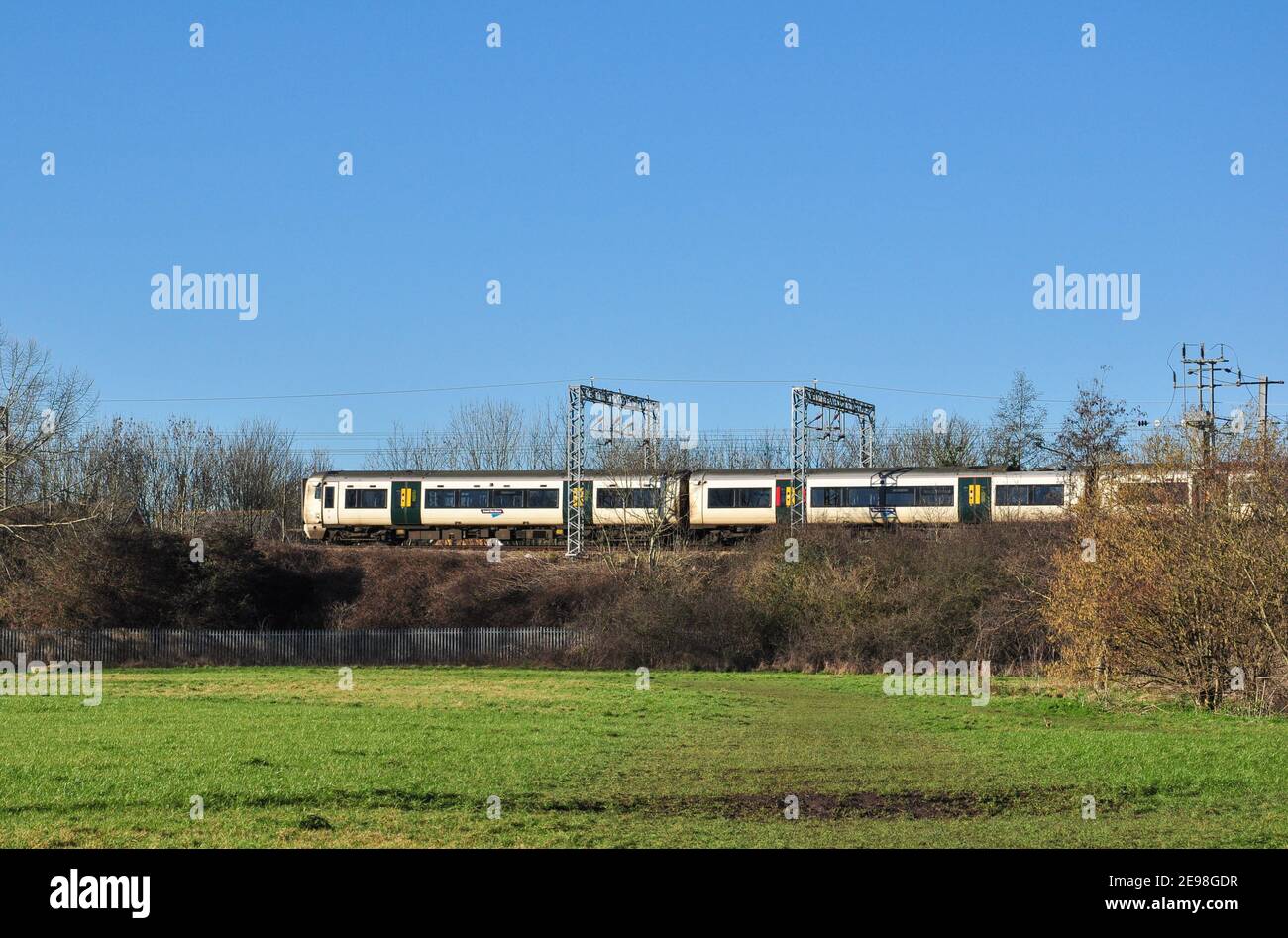 Class 387 EMU southbound train from the Cambridge line passes Walsworth ...