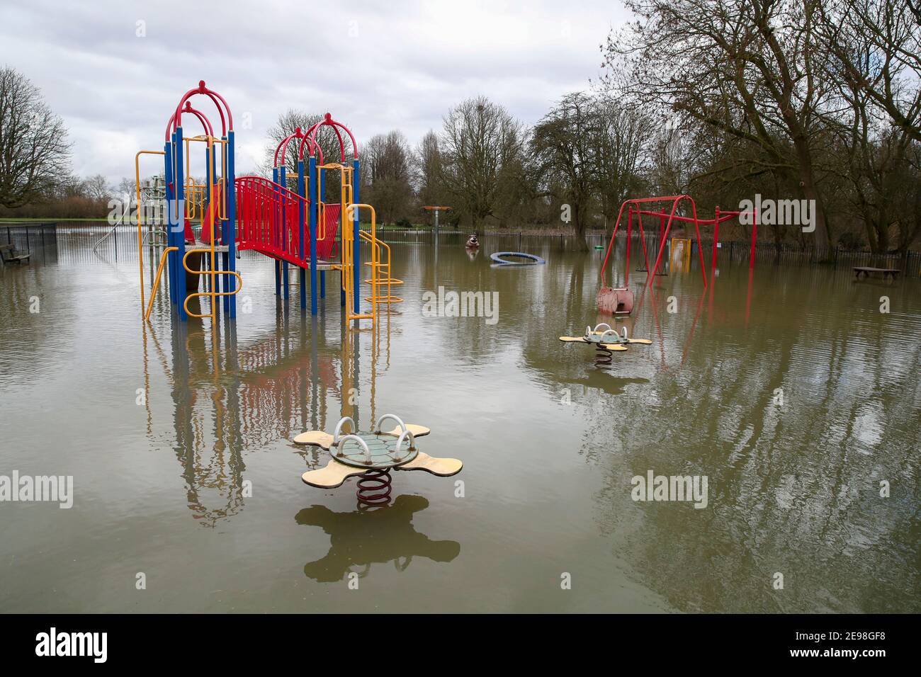 A flooded playground in Laleham-on-Thames, Surrey, after the banks of ...