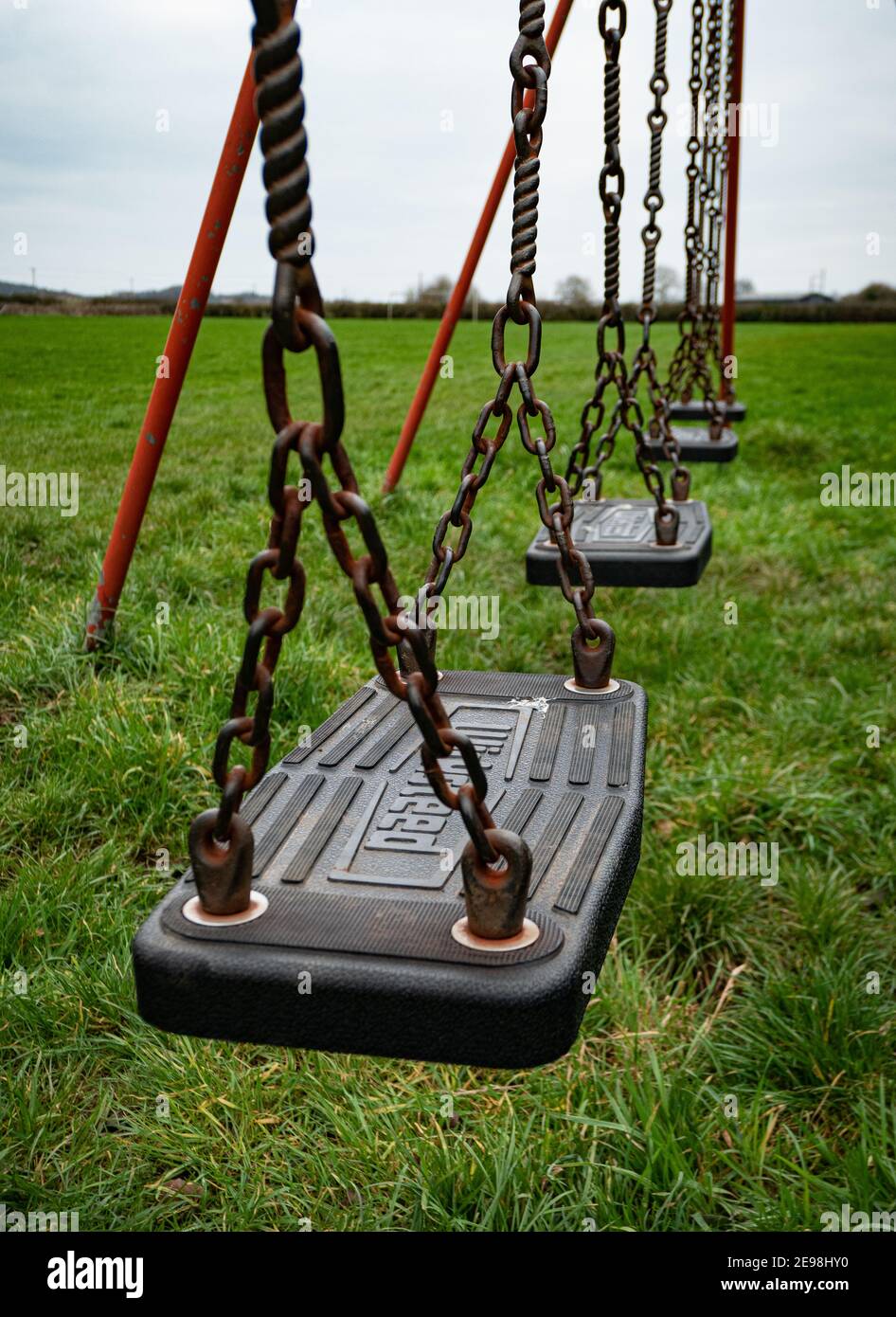 Childrens play swing England UK Stock Photo - Alamy