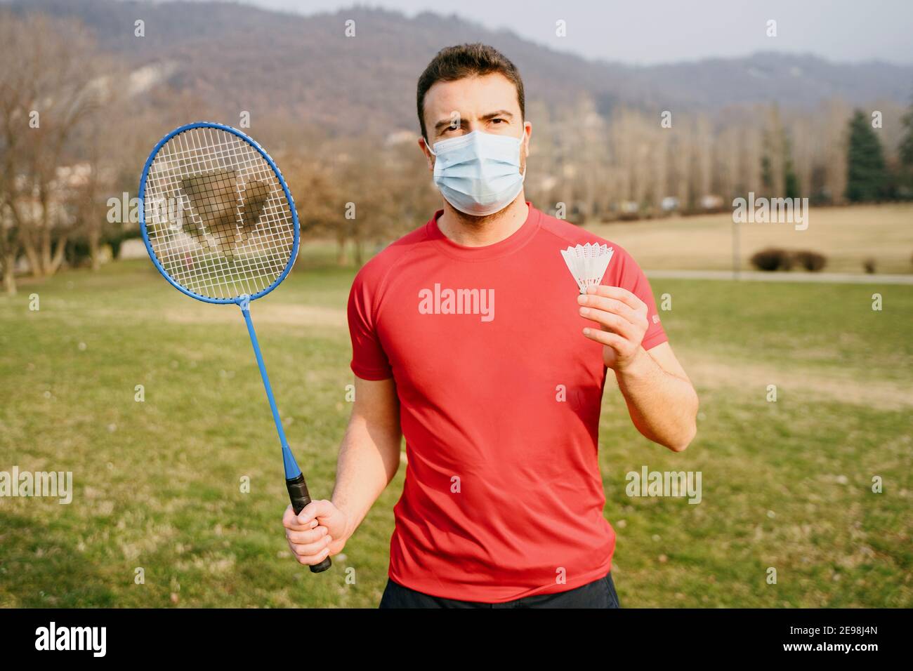 Young man playing badminton hi-res stock photography and images - Alamy