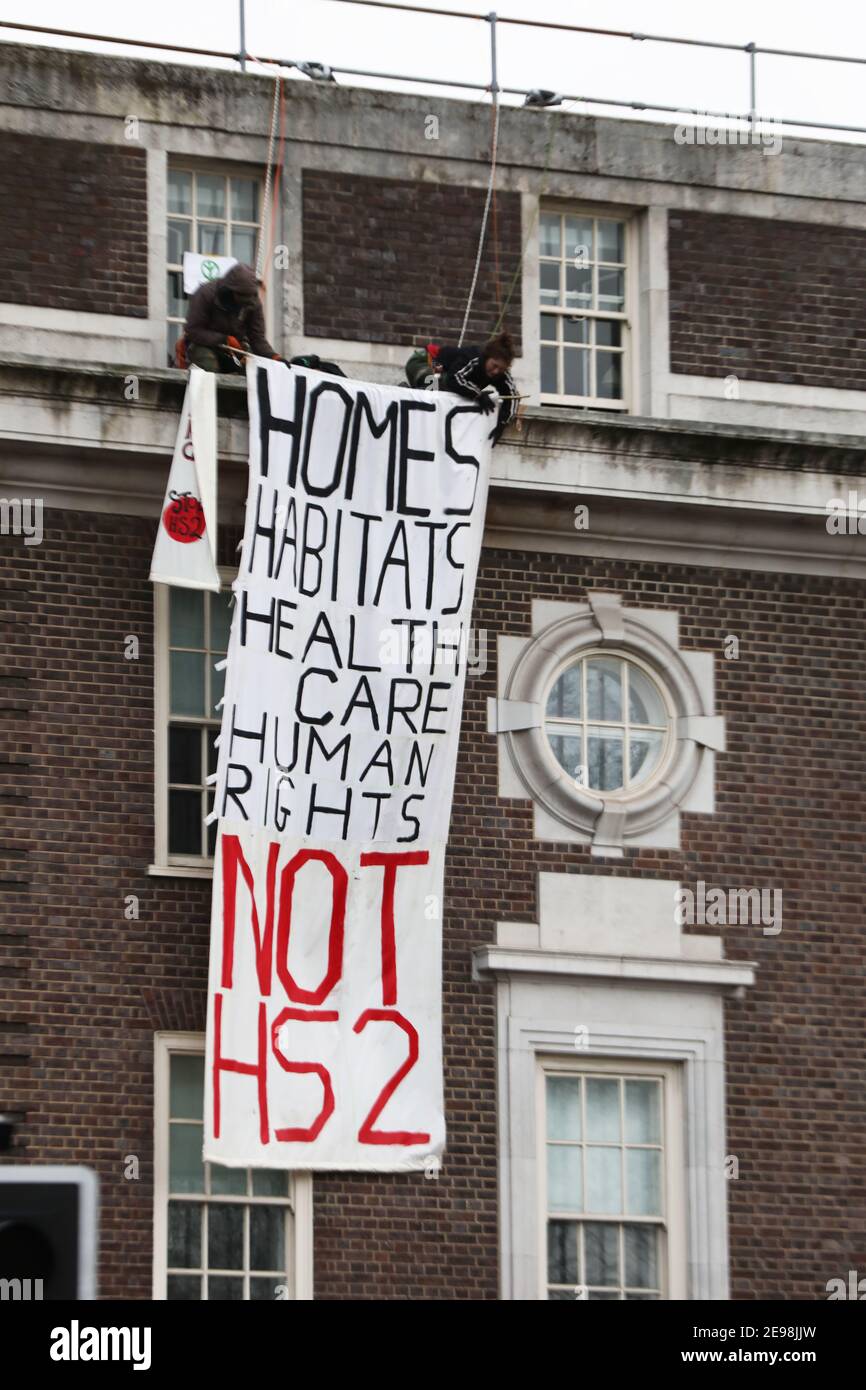 Protesters display an anti-HS2 banner after climbing Friends House in ...