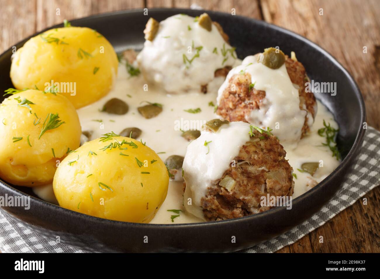 German meatballs in caper sauce hi-res stock photography and images - Alamy