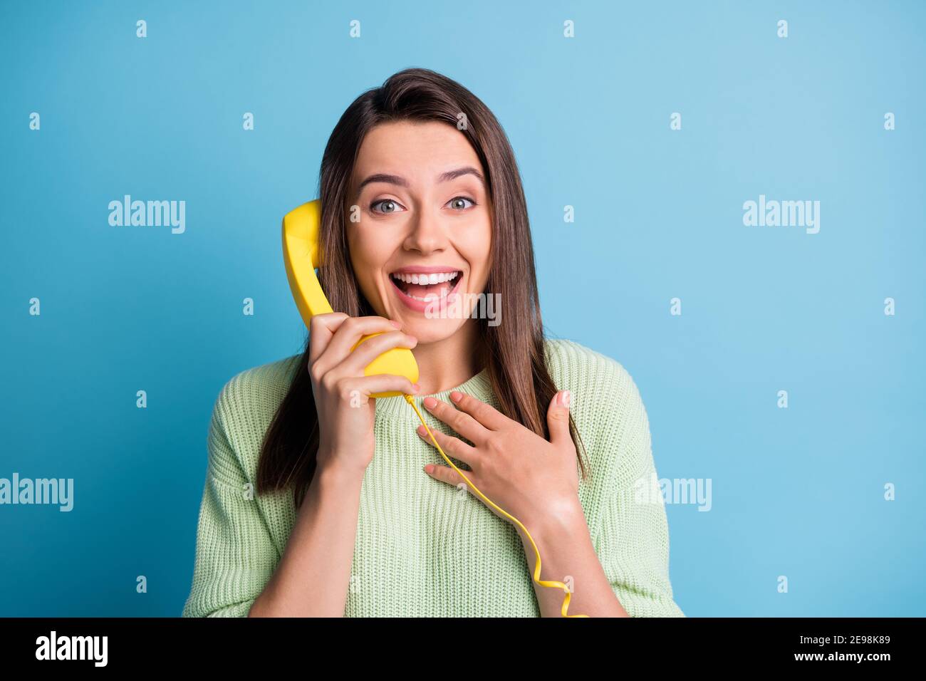 Photo of positive cheerful girl call telephone her friend laugh touch ...