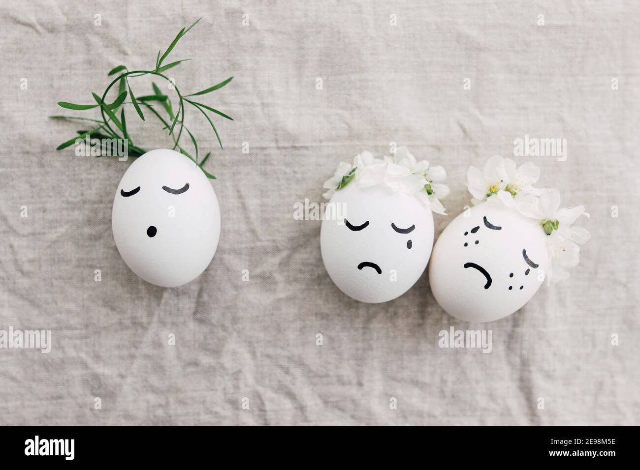 Easter concept. Natural eggs with sad crying and calm faces in cute ...