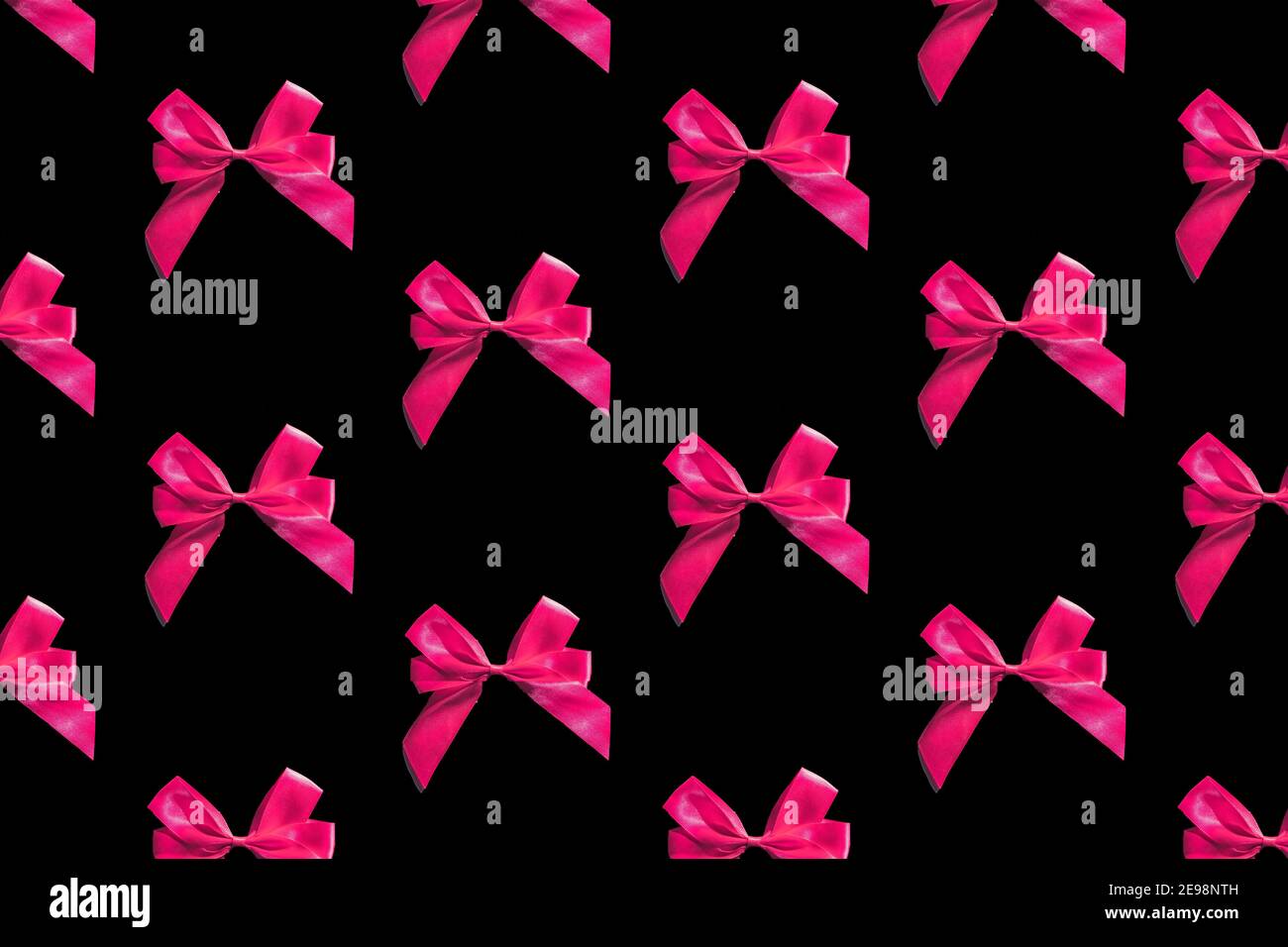 Pink bows pattern on black background. Gift wrapping Stock Photo - Alamy