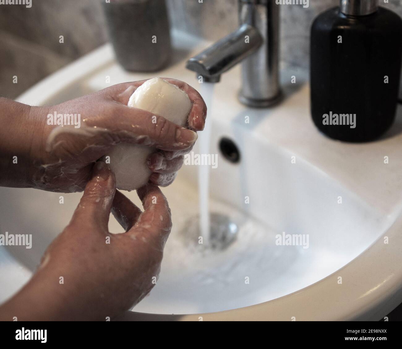 Woman washing hands bar soap hi-res stock photography and images - Alamy