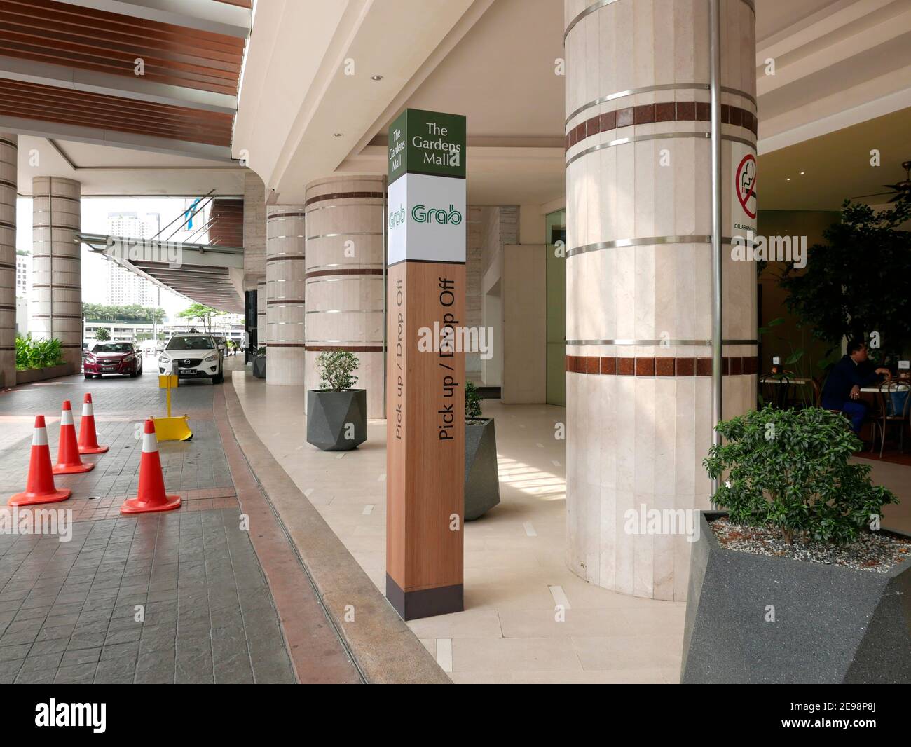 Grab Taxi stand at the Garden Mall Stock Photo - Alamy