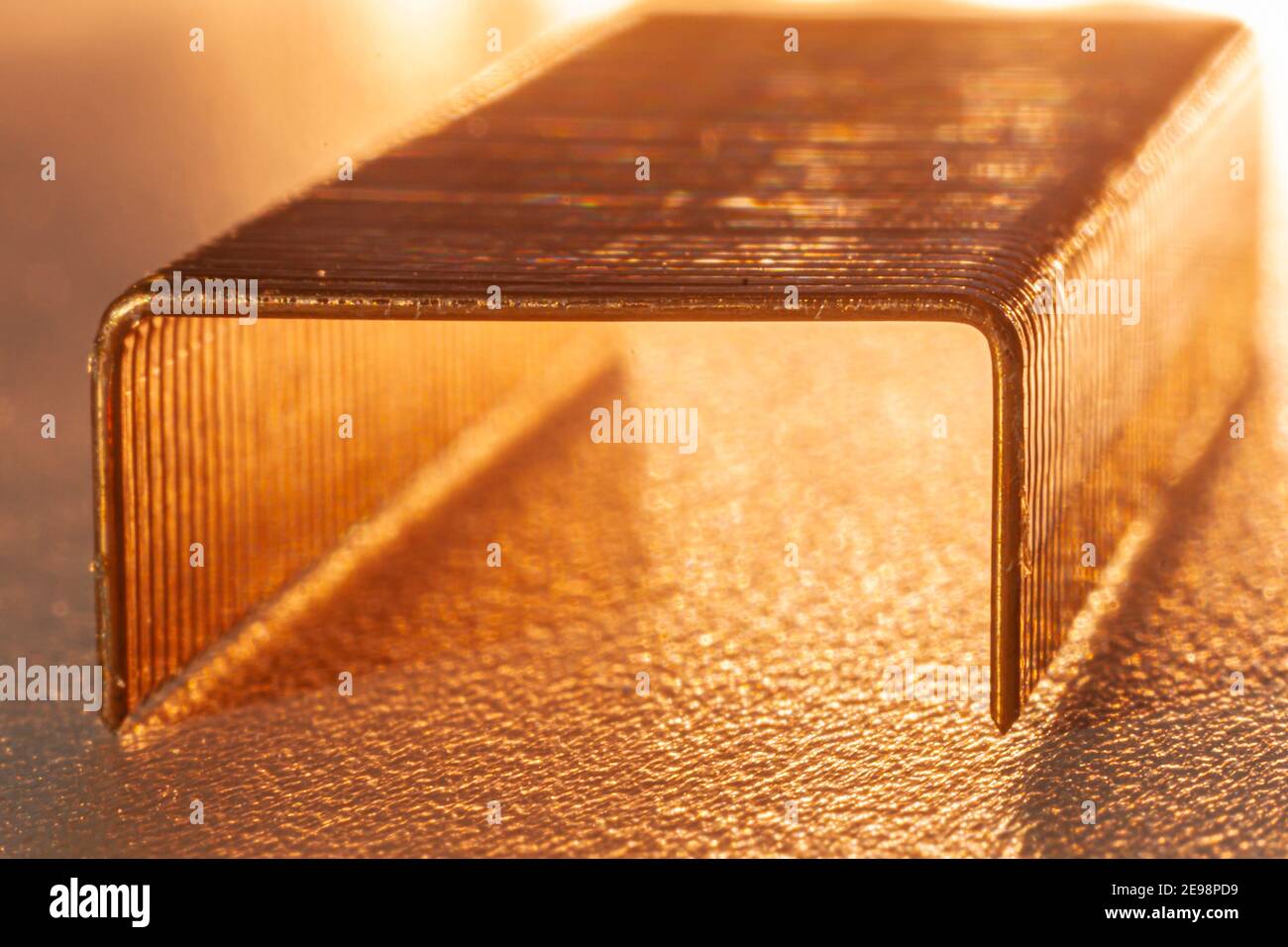 Coppered staples photographed close-up in brown tones. Group of copper ...