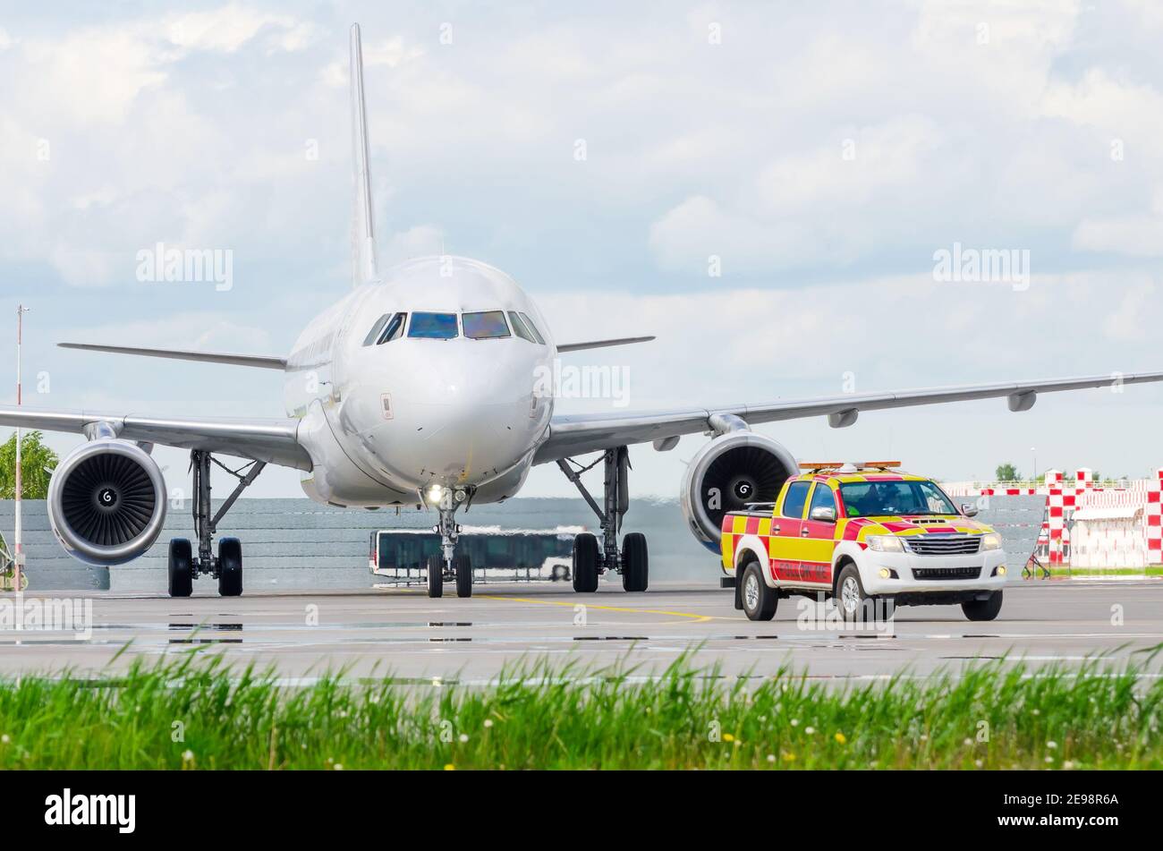 Escorting a passenger airliner by car - follow me after landing at the ...