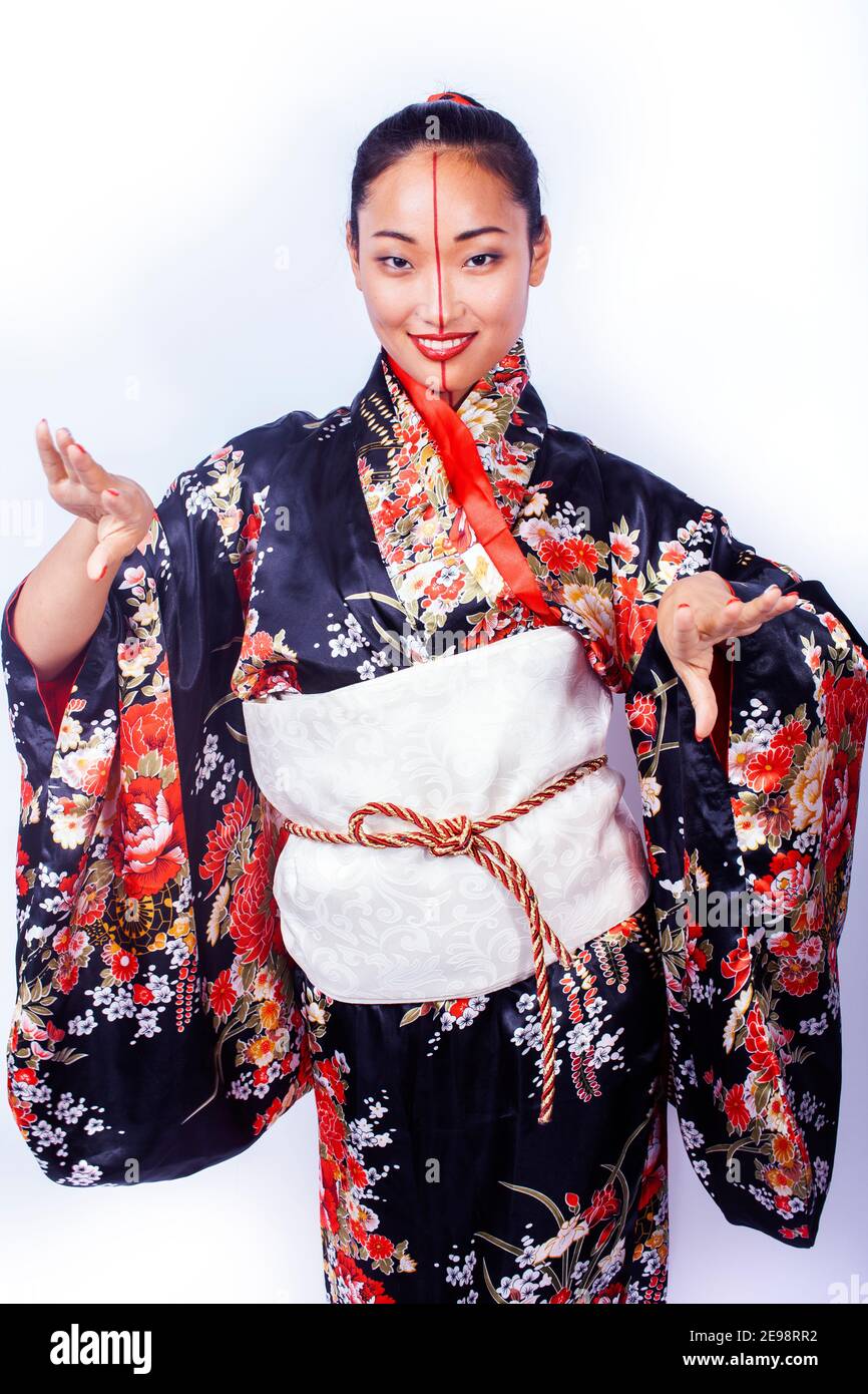 young pretty geisha in black kimono with sakura, asian ethno closeup on ...