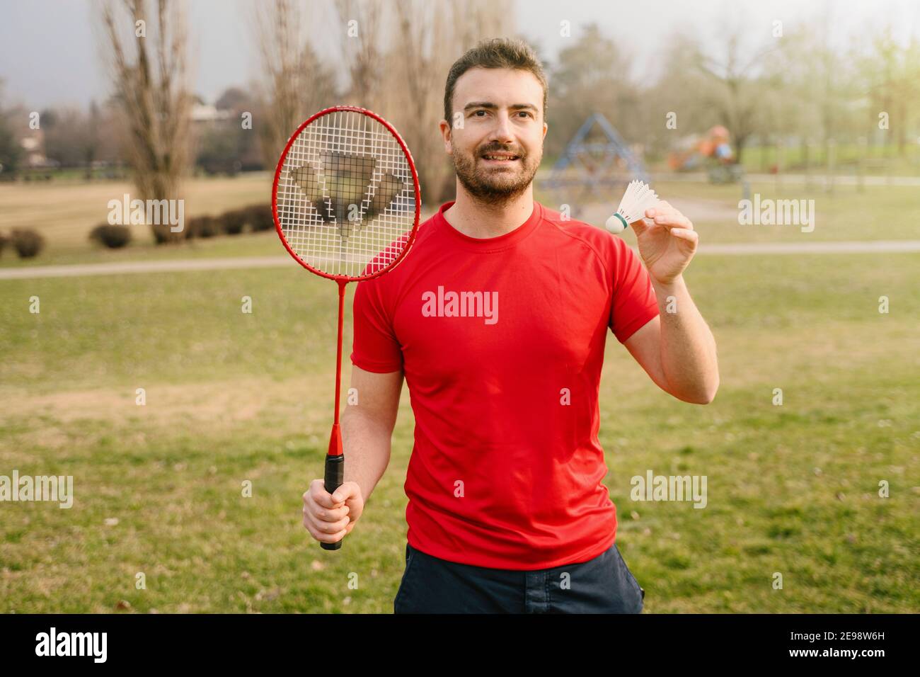 Young man playing badminton hi-res stock photography and images - Alamy