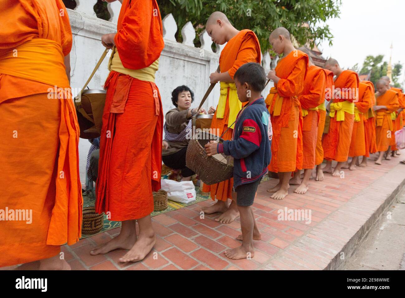 Child giving alms hi-res stock photography and images - Alamy