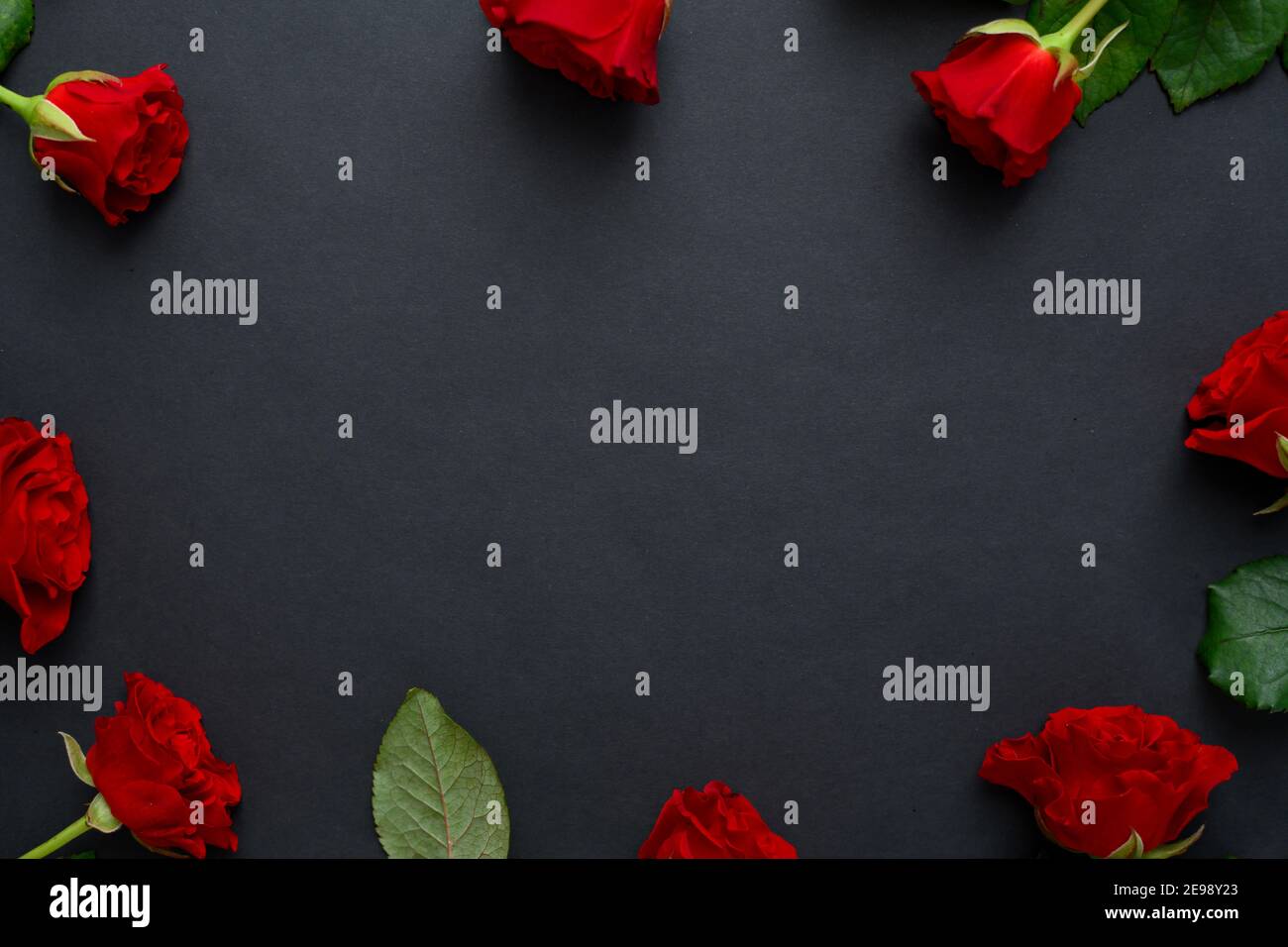 Red roses frame on a black background, copyspase Stock Photo - Alamy