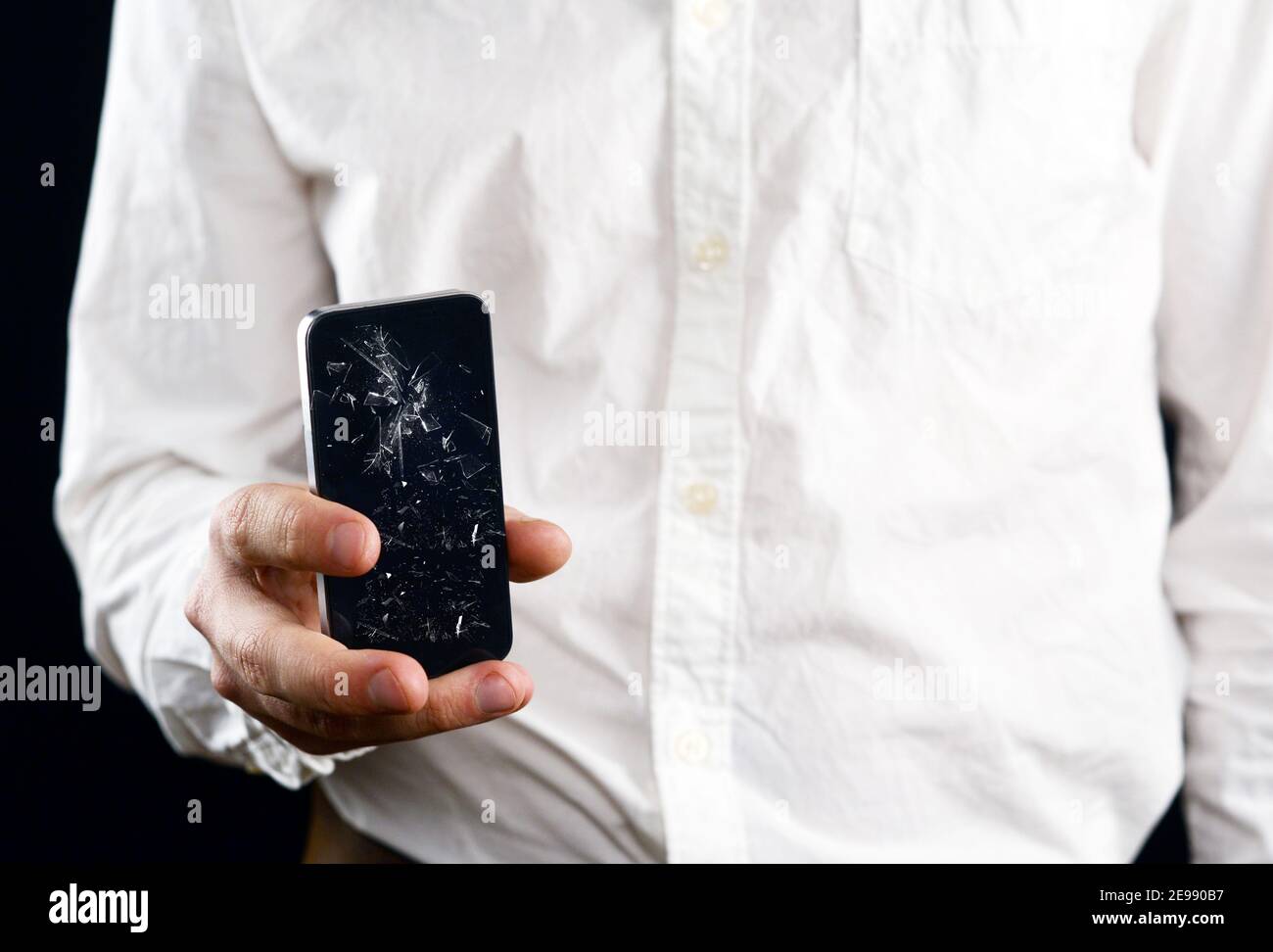 Person hold a Smartphone with destroyed display Stock Photo - Alamy