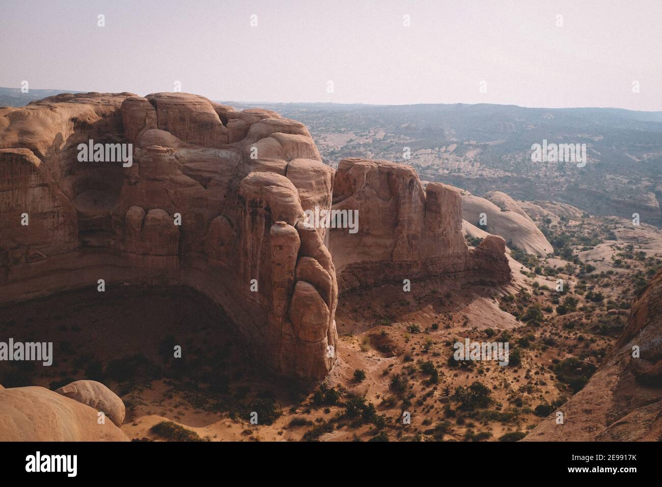 Soft Light Falls on a Desert Scene and Rock Formations Stock Photo - Alamy