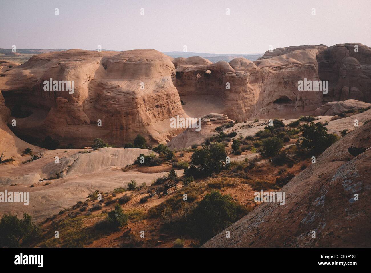 Soft Light Falls on a Desert Scene and Rock Formations Stock Photo - Alamy