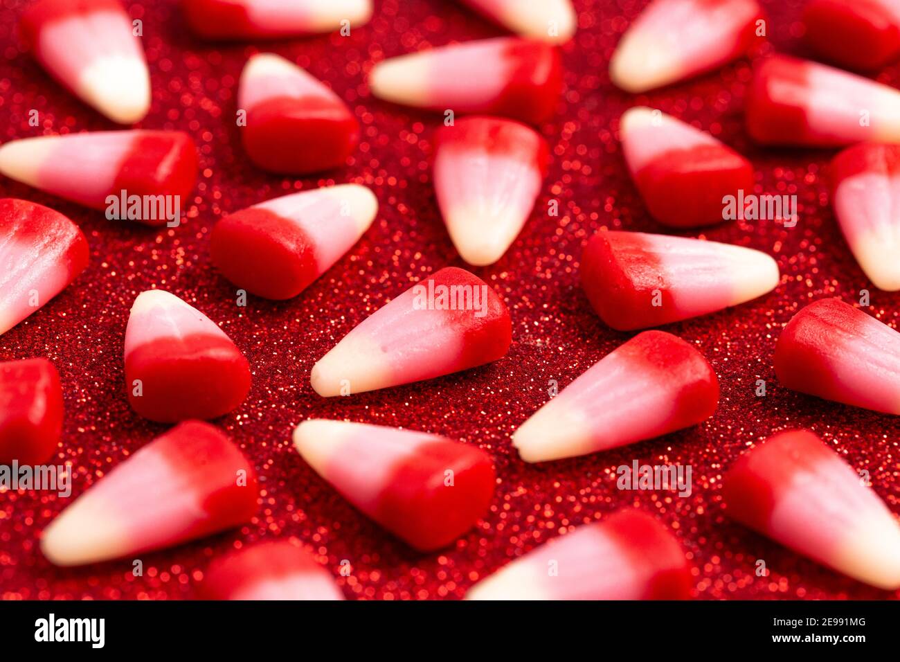 Red Pink and White Valentines Day Candy Corn on a Glittering Red ...