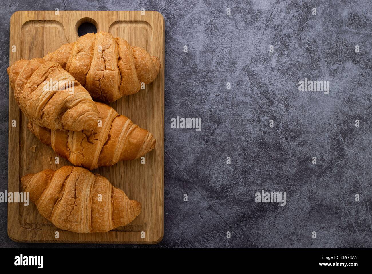 fresh croissants and coffee on stone background with copy space. Top view Stock Photo - Alamy