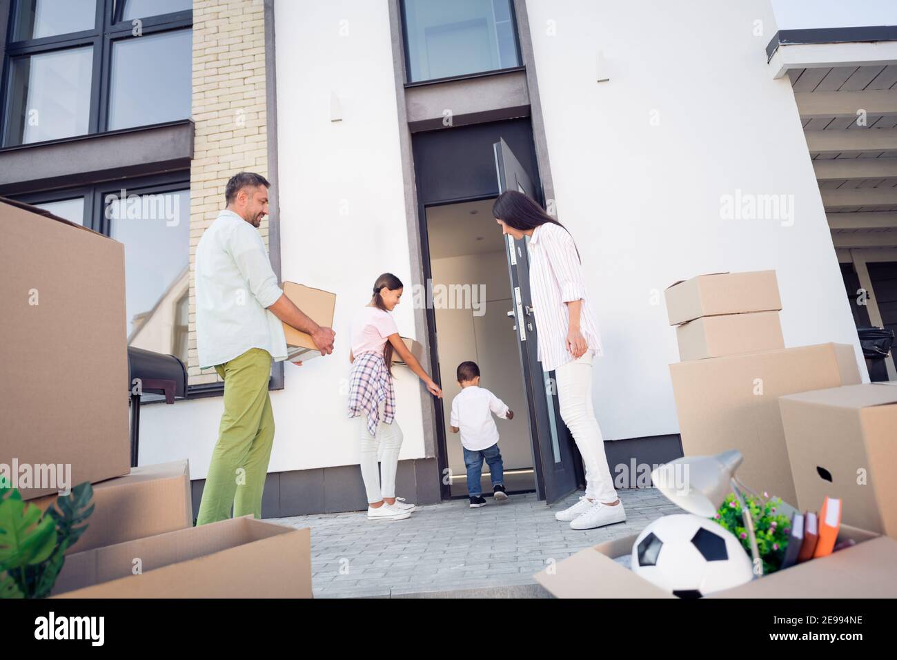 Mother father son entering hi-res stock photography and images - Alamy