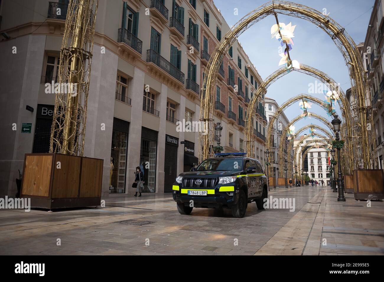 Malaga, Spain. 3rd Feb, 2021. A police car seen patrolling at an empty ...