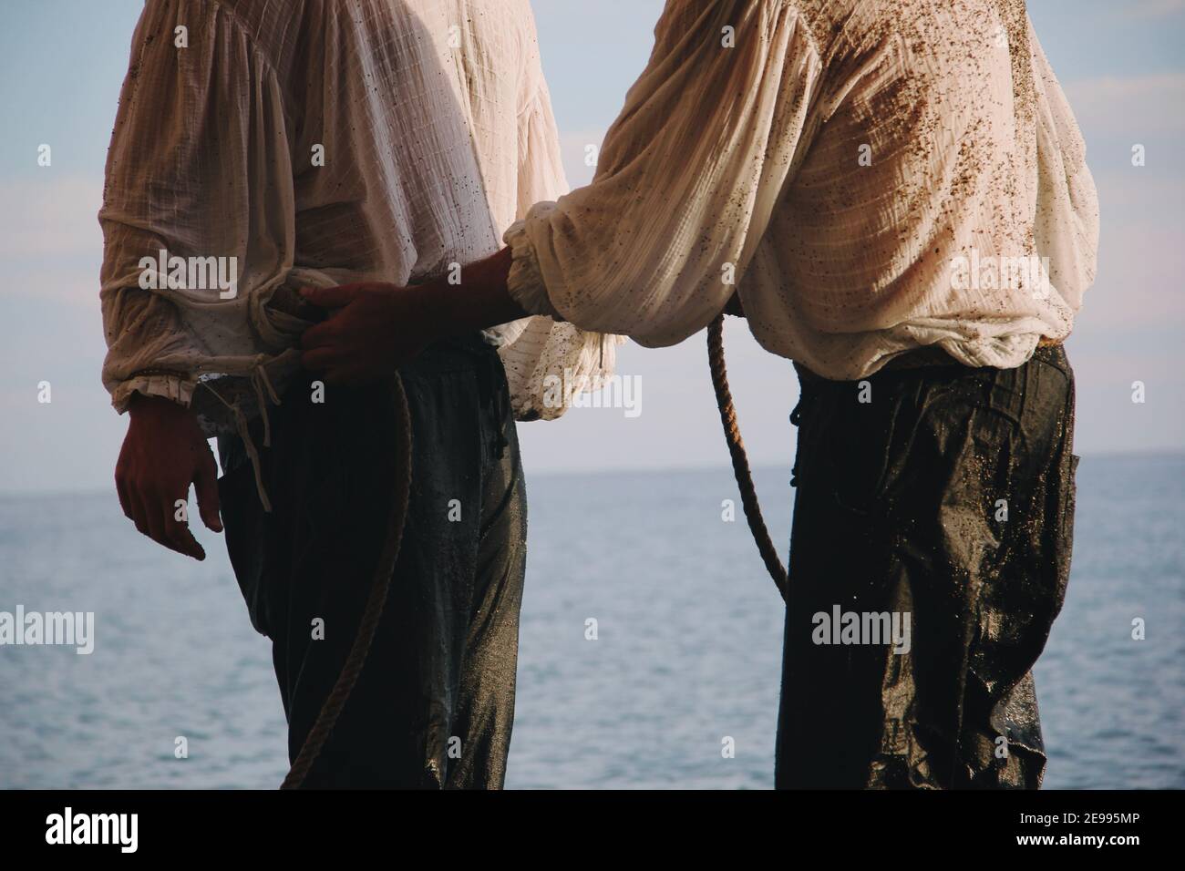 Man hands tied rope hi-res stock photography and images - Alamy