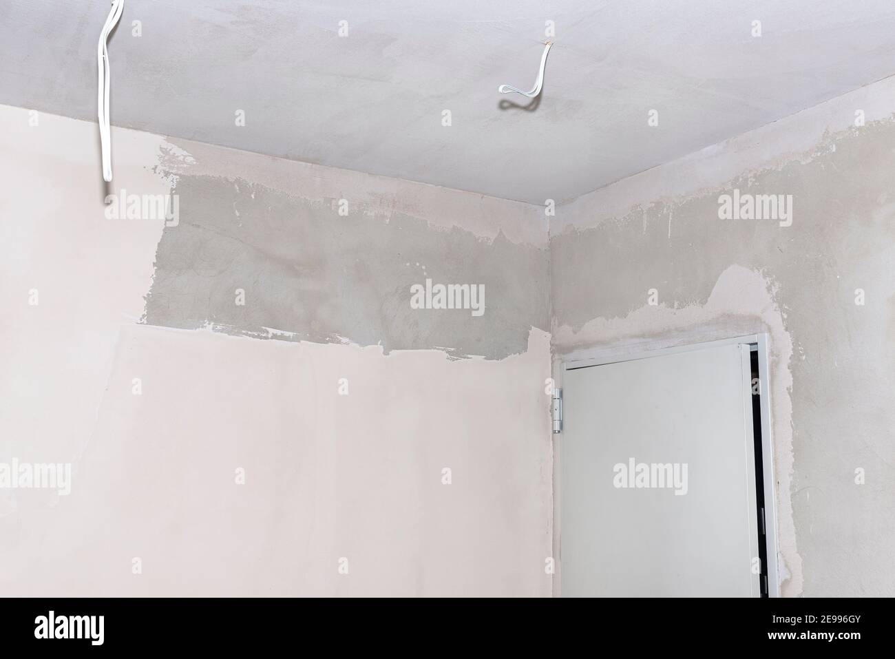Freshly laid gypsum on the walls and ceiling of a newly built detached ...