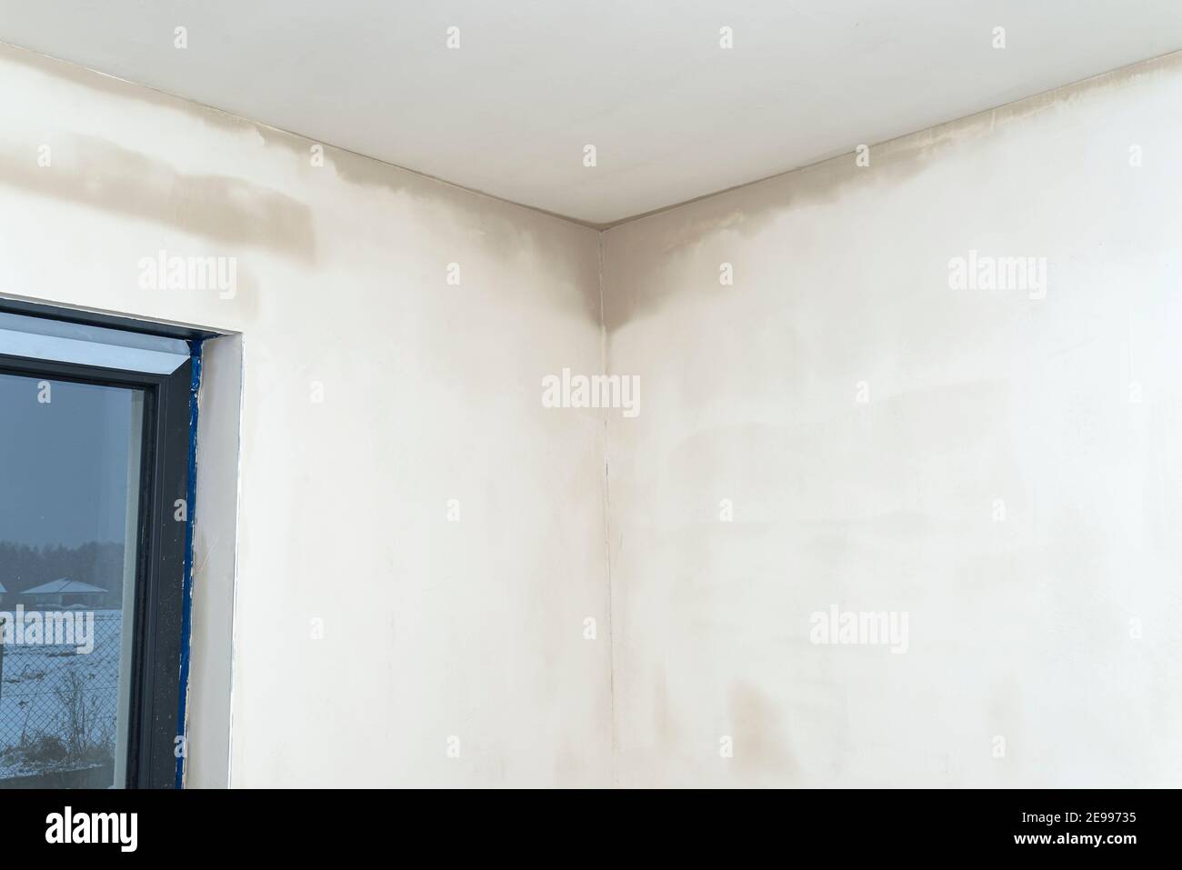 Freshly laid gypsum on the walls and ceiling of a newly built detached ...