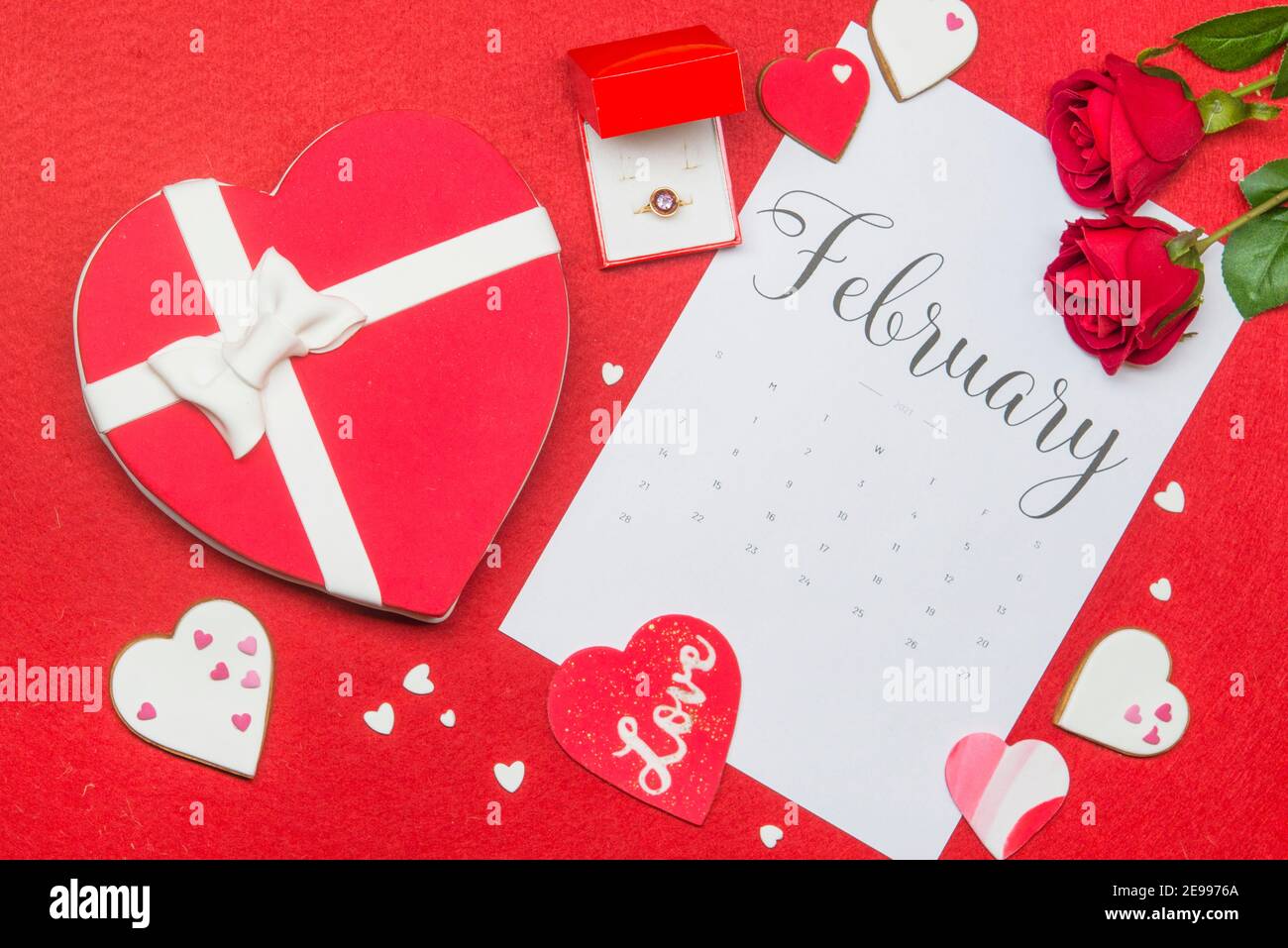 Engagment background (ring, flowers, red background Stock Photo - Alamy