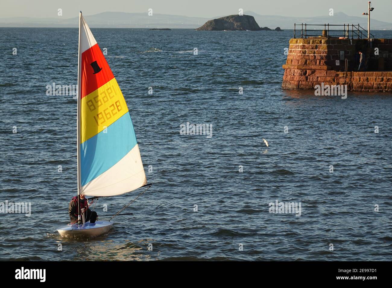 Topper Sailing Dinghy approaches the beach at North Berwick Stock Photo ...
